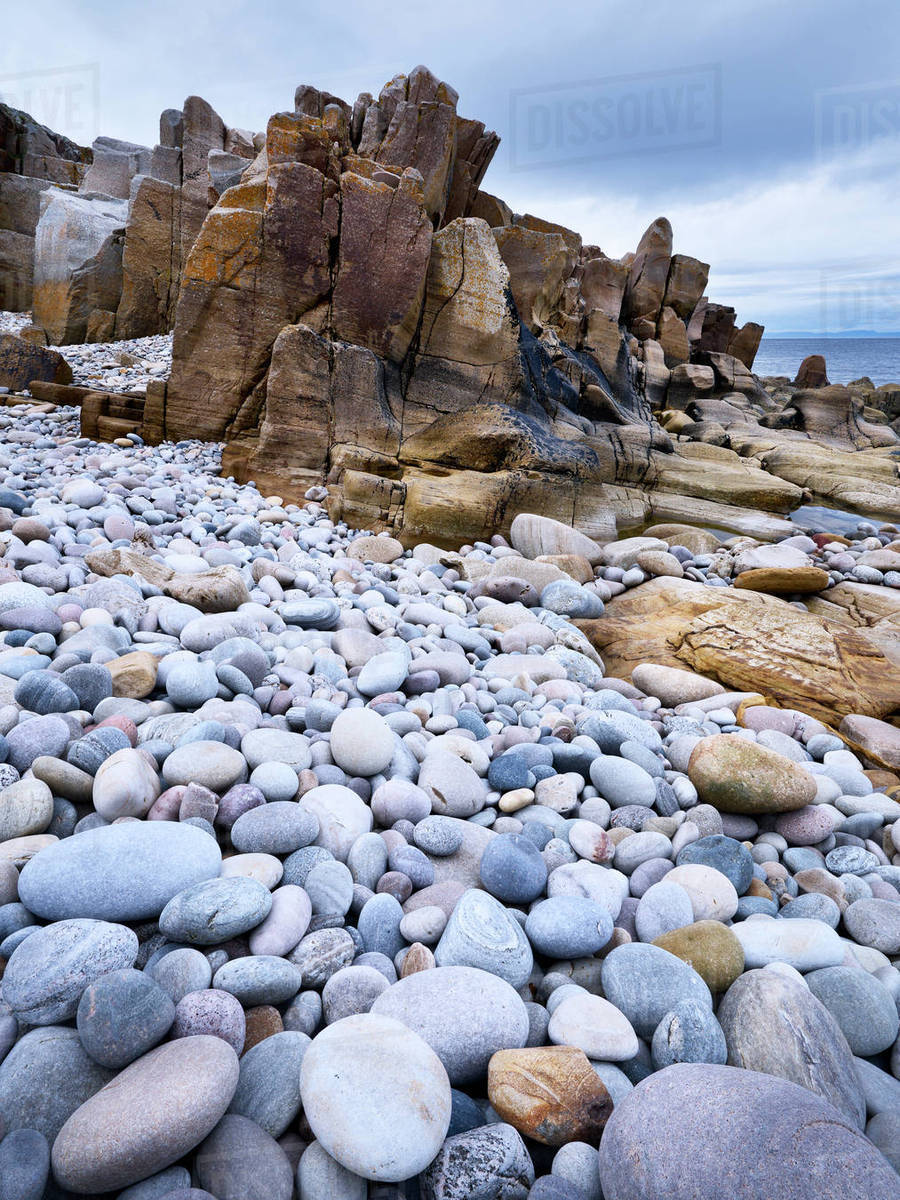 Pebbles on beach - Stock Photo - Dissolve