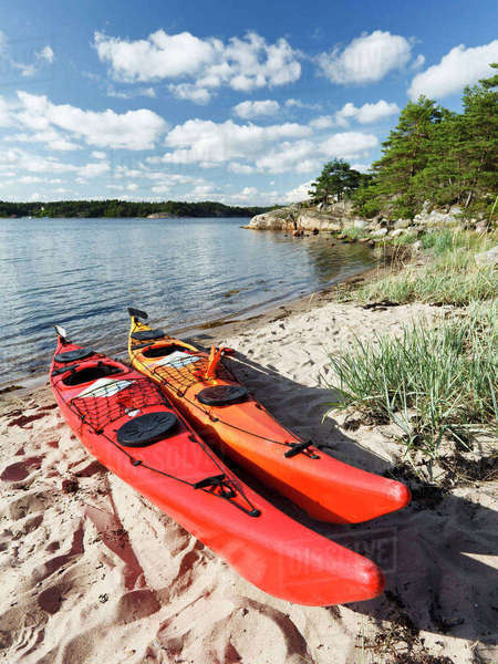 Canoes on sandy beach - Royalty-free Stock Photo | Dissolve