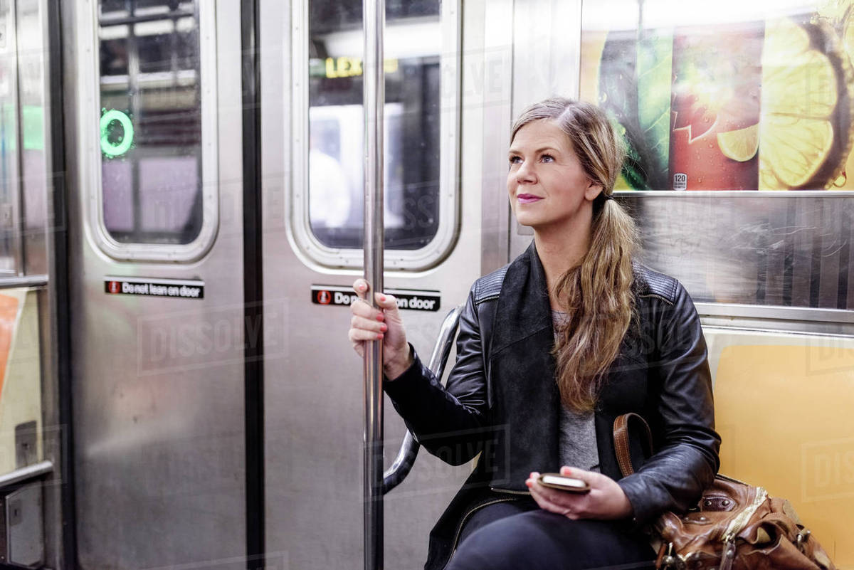 Woman in subway train - Royalty-free Stock Photo | Dissolve
