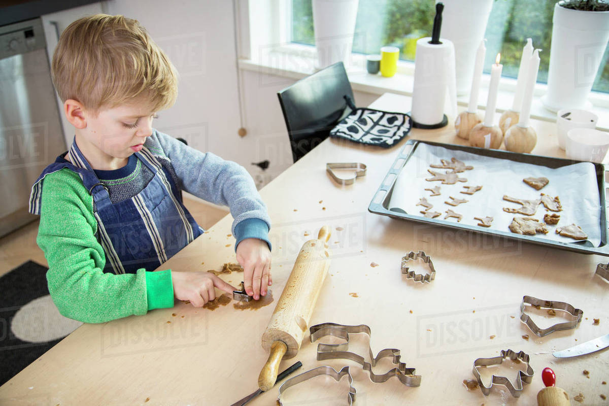 Boy making cookies - Royalty-free Stock Photo | Dissolve