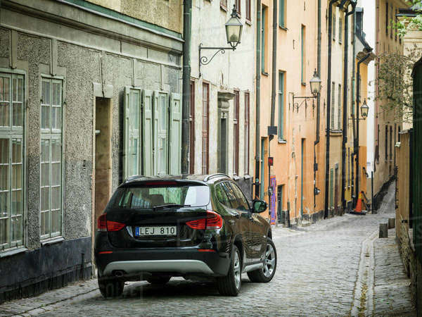 Car on narrow street - Stock Photo - Dissolve