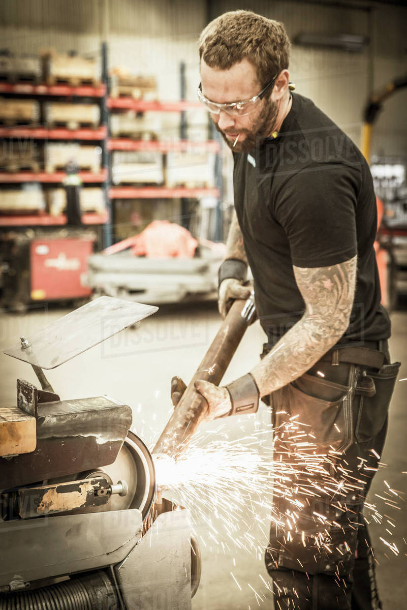 Man working in workshop - Stock Photo - Dissolve