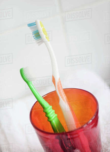 Toothbrushes in glass - Stock Photo - Dissolve