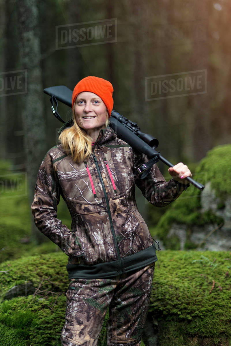 Woman hunting in forest - Stock Photo - Dissolve