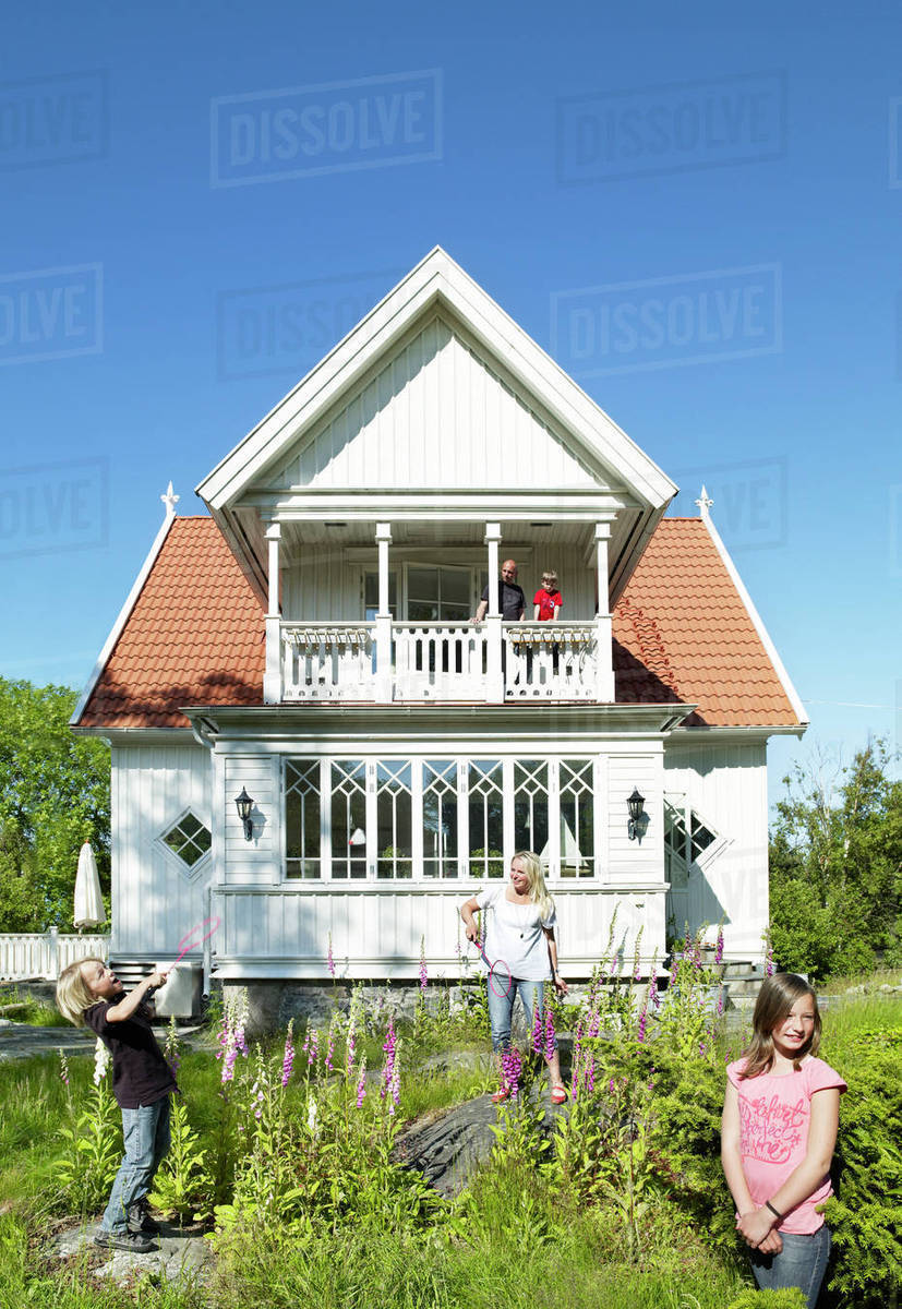 Family in garden - Stock Photo - Dissolve