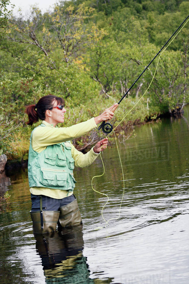 Woman fishing - Royalty-free Stock Photo | Dissolve