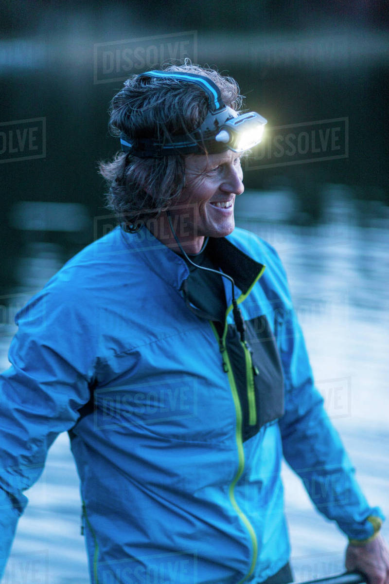 Smiling man with headlight - Royalty-free Stock Photo | Dissolve