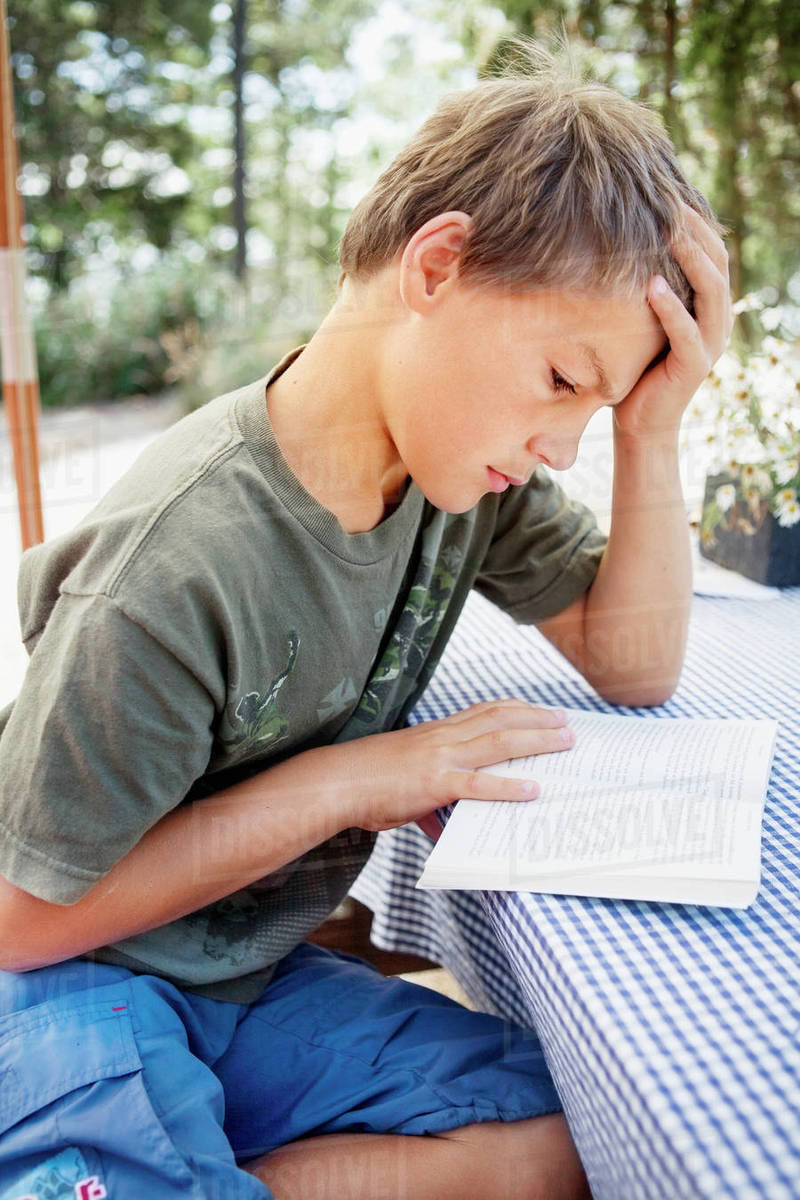 Boy reading - Royalty-free Stock Photo | Dissolve