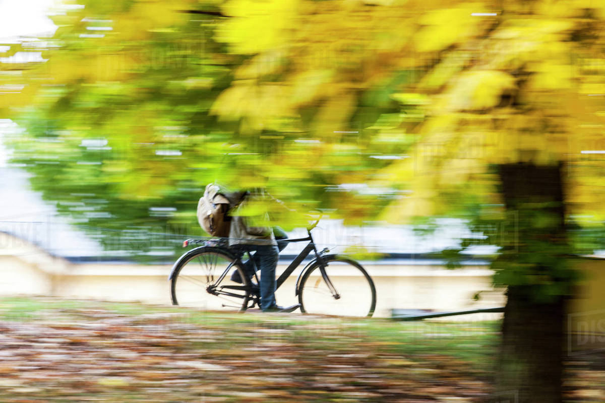 Person cycling - Stock Photo - Dissolve