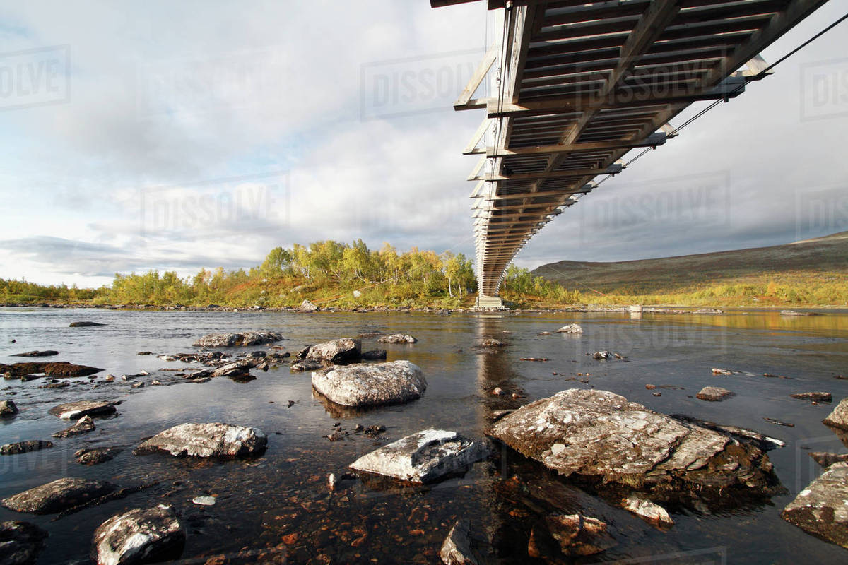 Footbridge above river - Royalty-free Stock Photo | Dissolve