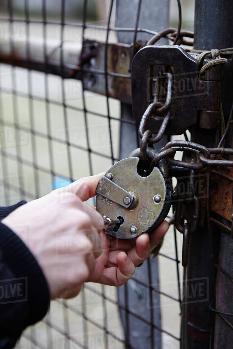 Hands opening padlock - Royalty-free Stock Photo | Dissolve