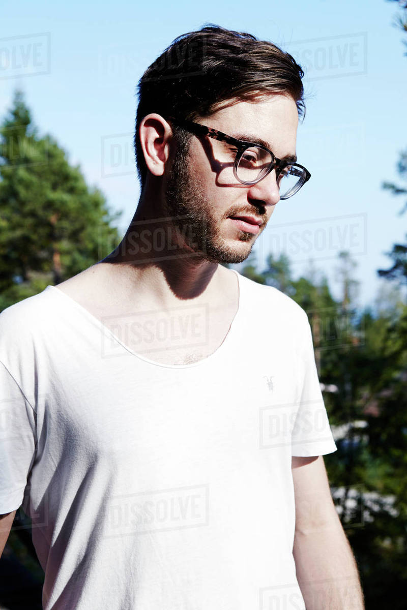 Young man looking away - Royalty-free Stock Photo | Dissolve