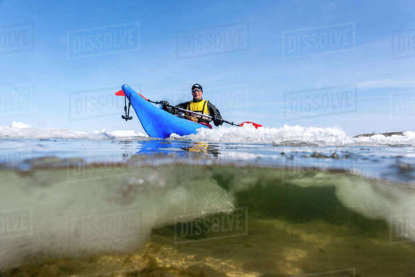 Person kayaking on sea - Royalty-free Stock Photo | Dissolve