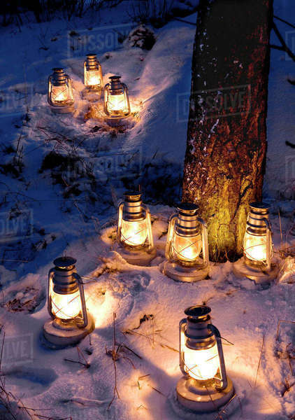 Illuminated lanterns on snow - Royalty-free Stock Photo | Dissolve