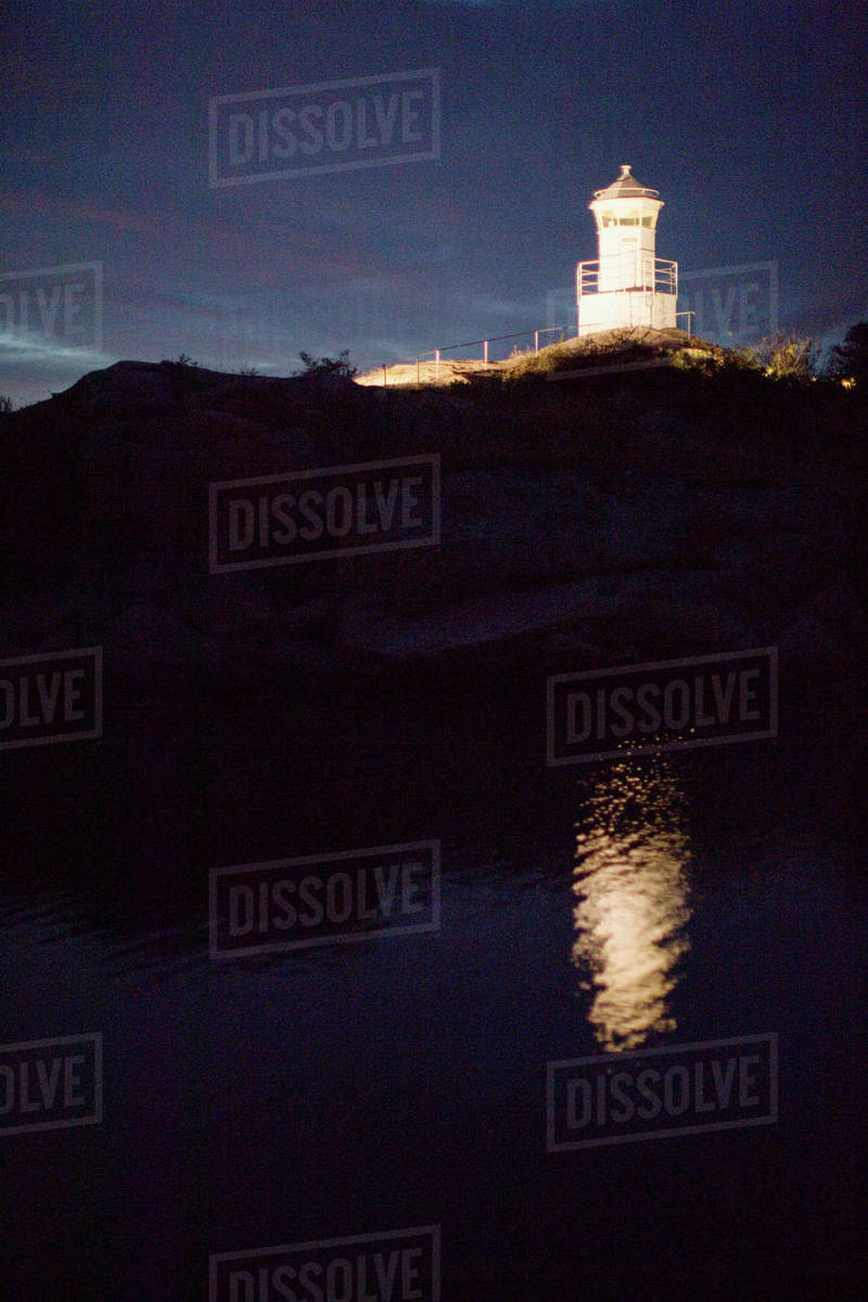 Illuminated lighthouse - Royalty-free Stock Photo | Dissolve