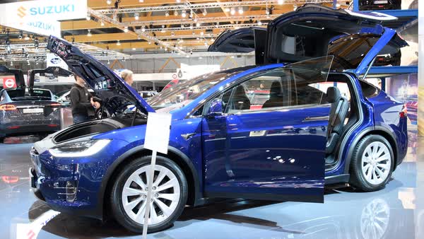 Tesla Model X all-electric, luxury, crossover SUV car with open doors ...