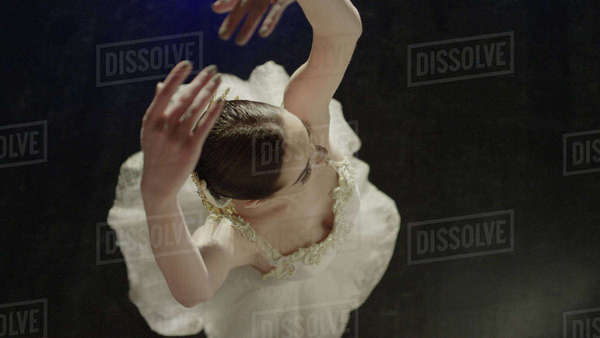 Overhead view of serious ballet dancer dancing in costume - Royalty ...