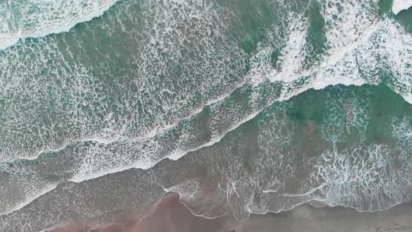 Aerial looking straight down onto large swell and waves. Overhead view ...