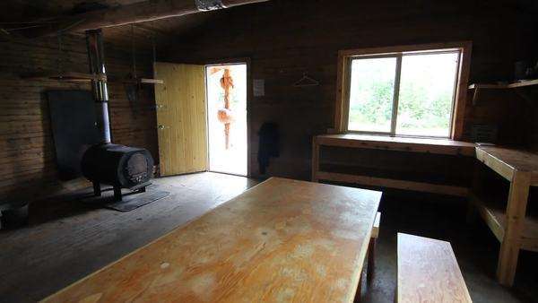 Nature Rain Trees Cabin. Interior of log cabin with wooden table and ...