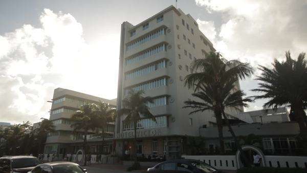 Hotel Buildings City Streets. Hotel across the street. Cars and people ...