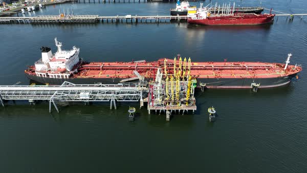 Crude Oil Liquid Cargo Transporter Ship Unloading Petrochemicals to a ...