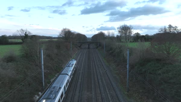 Commuter Railway Train At Dusk Aerial View - 4K Royalty-free Stock ...
