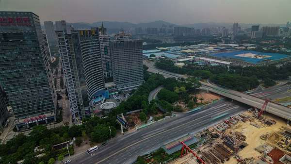 Shenzhen rainy sky roof top city traffic and constriction, timelapse ...