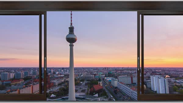 Berlin skyline aerial view timelapse day to night seen through a window ...