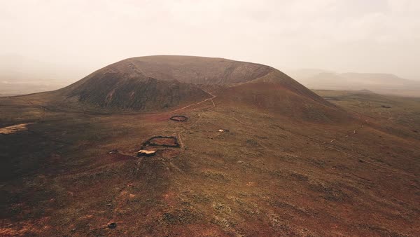 Approach to the crater of a dormant volcano, pizazh with hiking trails ...