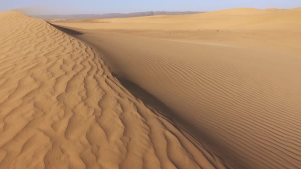 Desert sand blowing over sand dunes in wind - 4K Royalty-free Stock ...