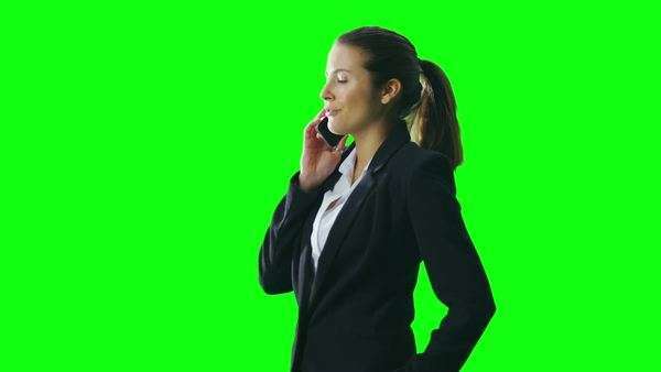 Businesswoman makes a phone call on green screen background - Stock ...