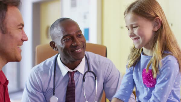 Friendly doctor talking to father and child patient - 4K Royalty-free ...