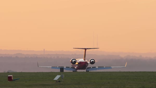 Cinematic shot of jet private jet with unrecognizable livery braking ...