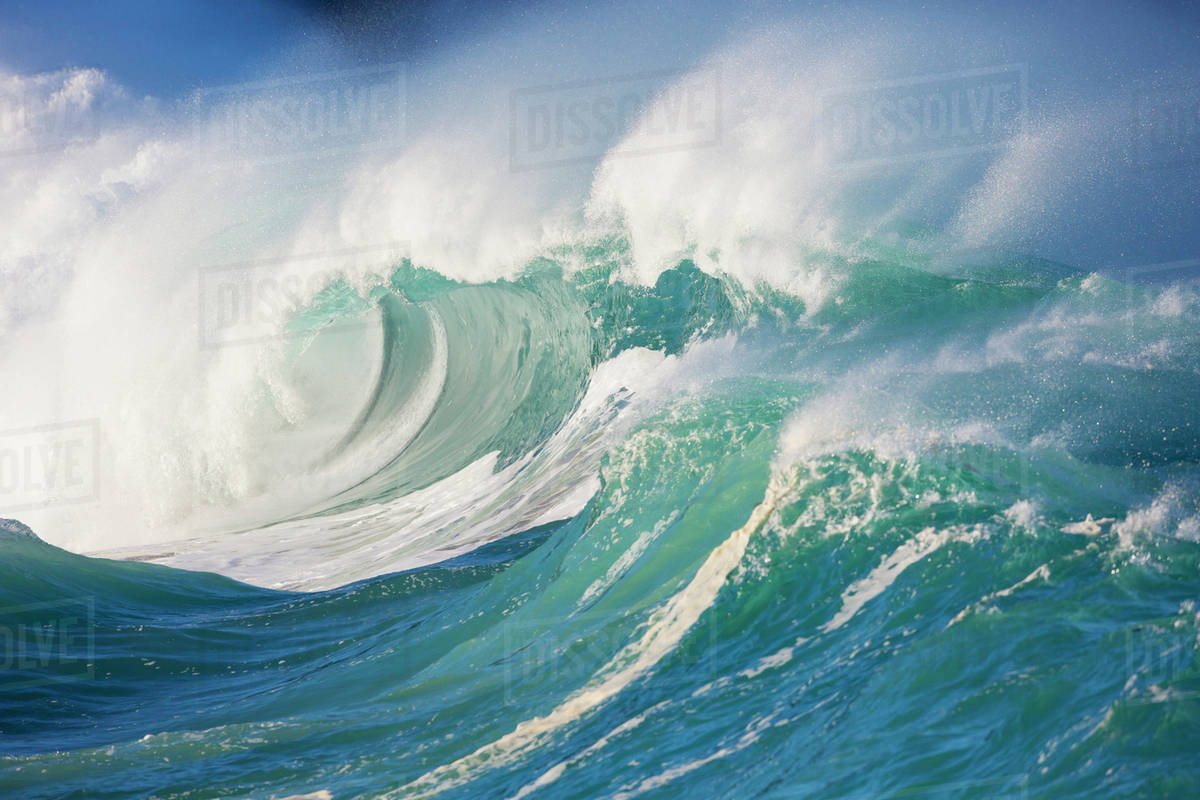 Waves breaking at Waimea Bay on the North shore of Oahu; Oahu, Hawaii ...