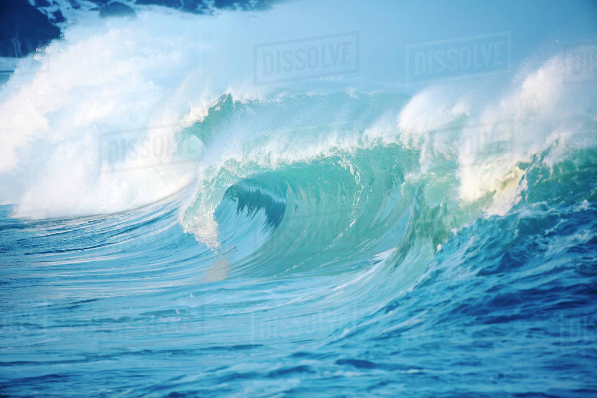 Waves breaking at Waimea Bay on the North shore of Oahu; Oahu, Hawaii ...