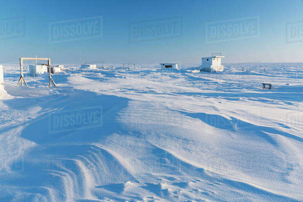 Snow Drifts cover summer camps buildings at point Barrow, Arctic Alaska ...