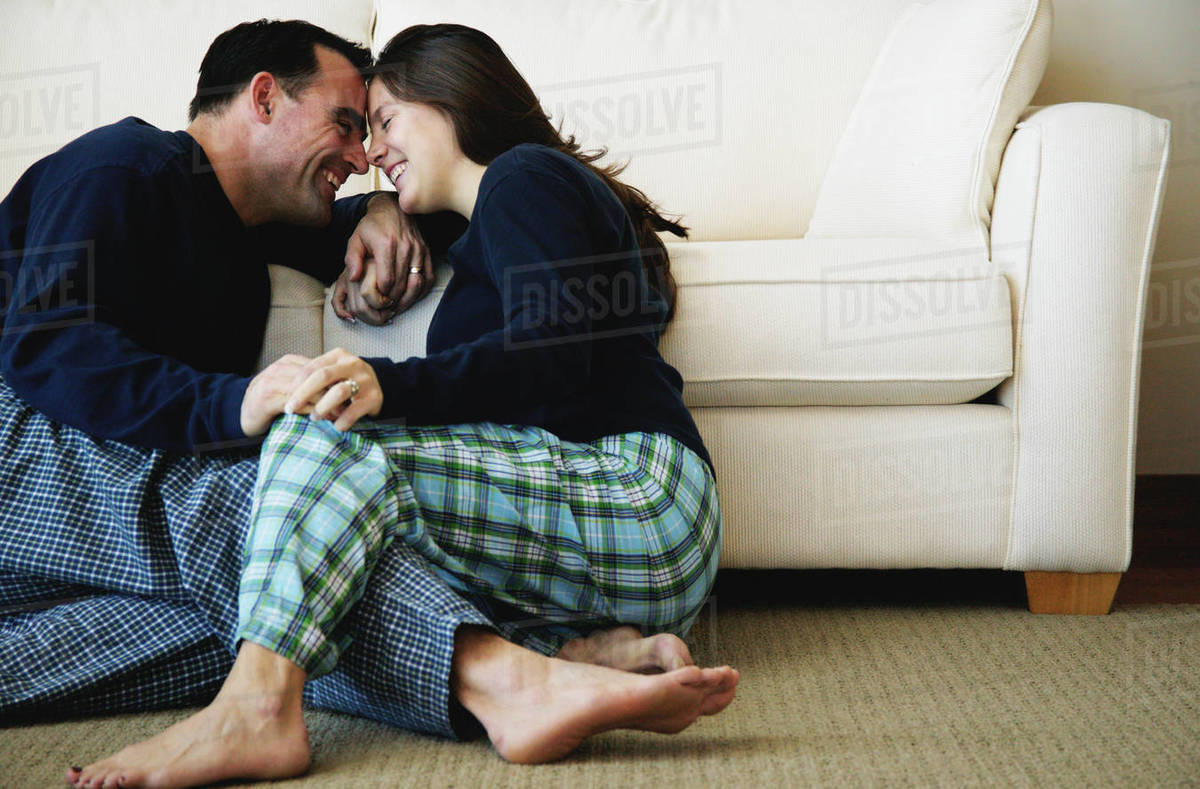 Couple Cuddling On Floor - Royalty-free Stock Photo | Dissolve