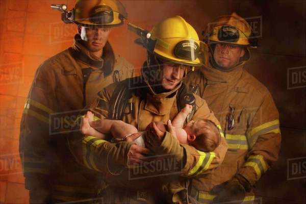 Fire Fighters Rescuing A Baby - Royalty-free Stock Photo | Dissolve