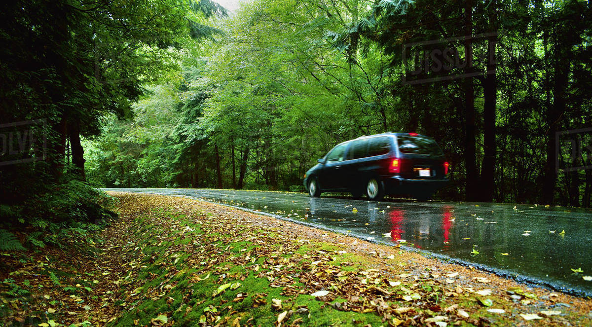Minivan Driving On A Wet Road - Royalty-free Stock Photo | Dissolve