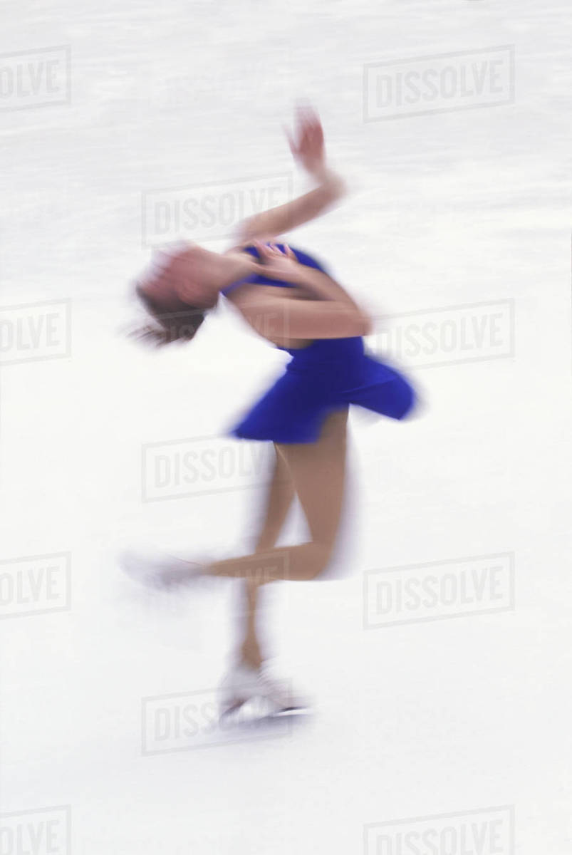 Woman Figure Skating - Stock Photo - Dissolve