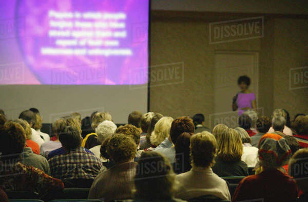Business Meeting With Words On Projector - Stock Photo - Dissolve