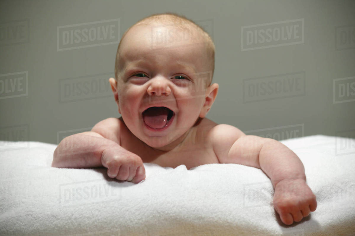 Smiling Baby Lying On Tummy - Royalty-free Stock Photo | Dissolve