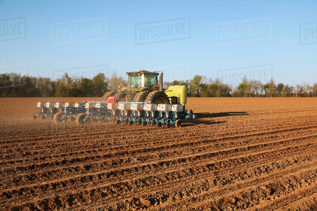 Agriculture - A John Deere tractor and Monosem 24 twin-row planter ...