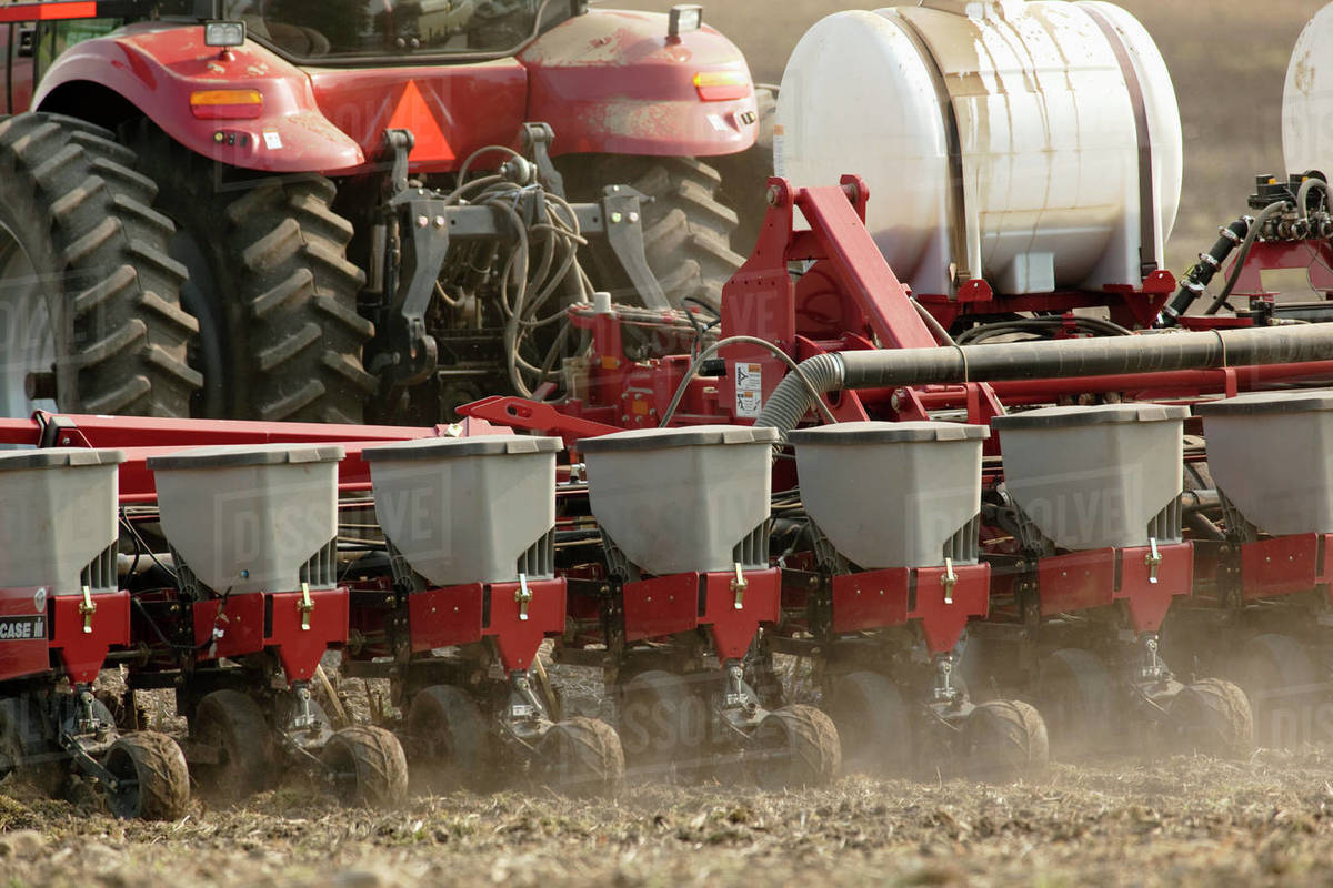 Agriculture - Planting corn using a Case IH tractor and 16-row planter ...