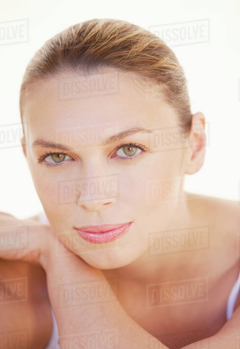 Portrait on a woman with hair pulled back on a white background; Hawaii ...