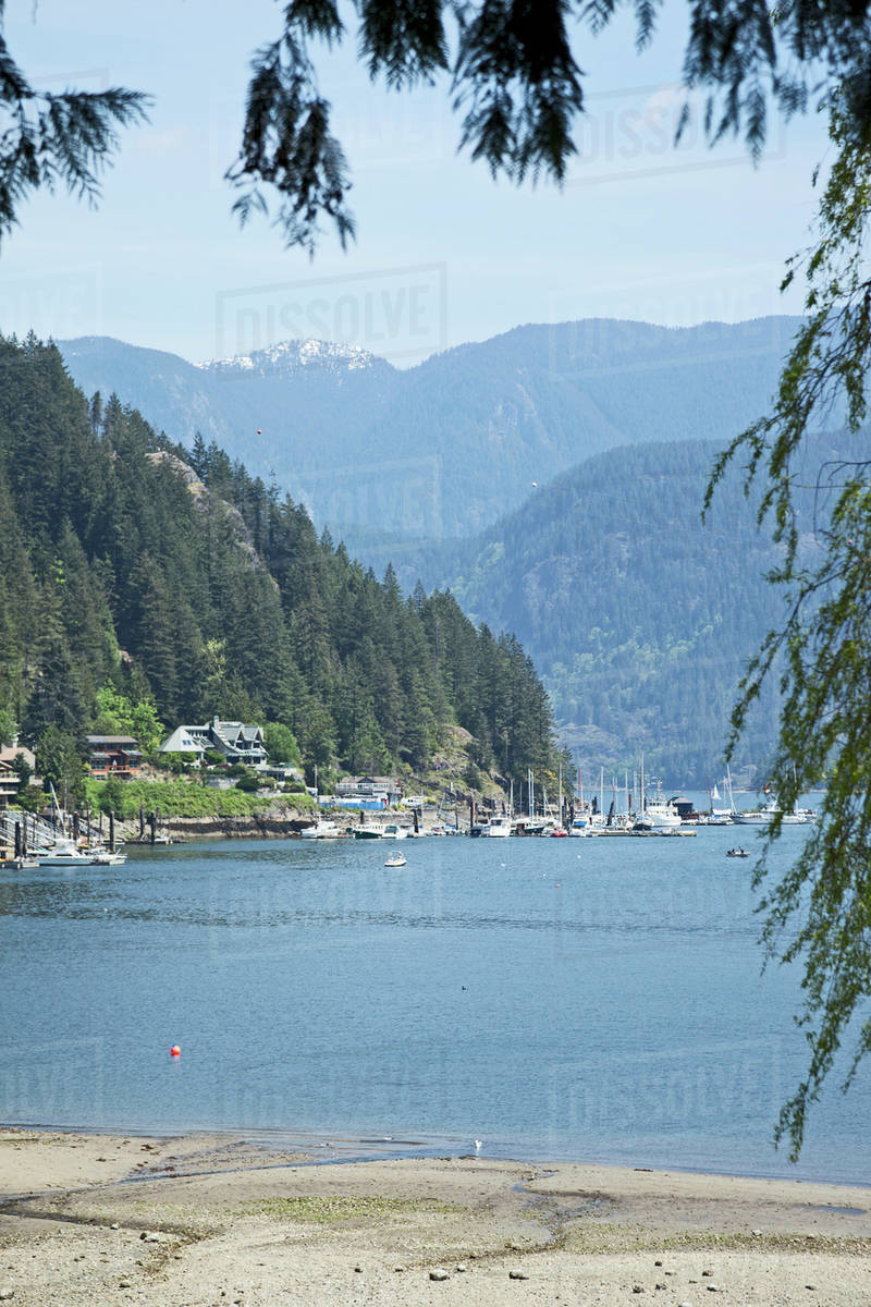 View of Deep Cove from beach with mountains in background, North ...