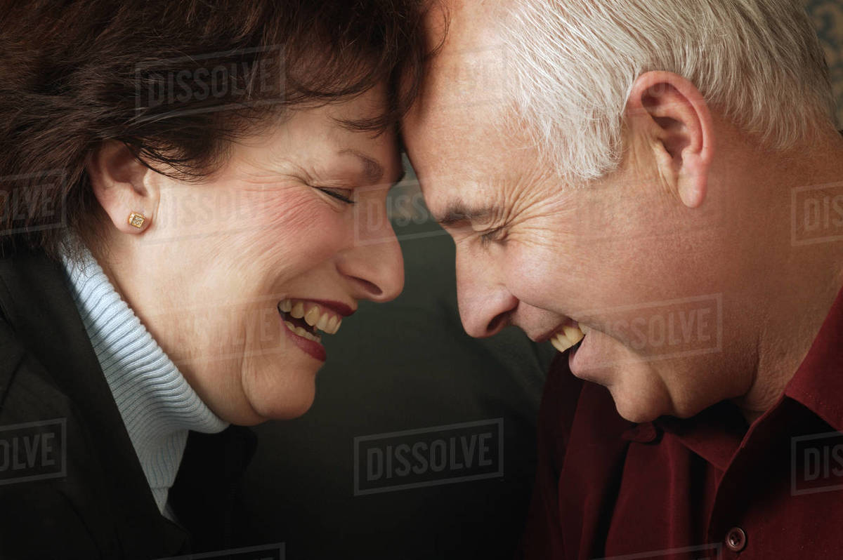 Married Couple Laugh Together - Royalty-free Stock Photo | Dissolve