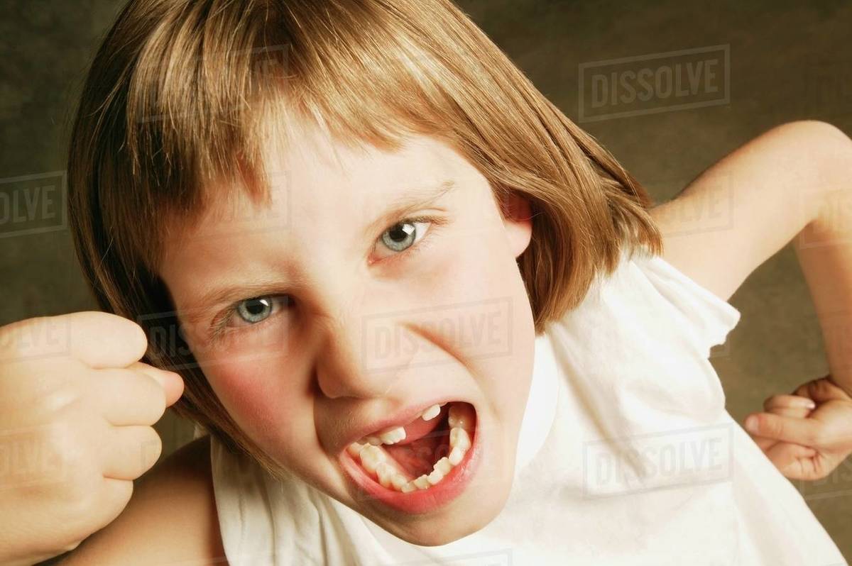 Child With Fists - Stock Photo - Dissolve