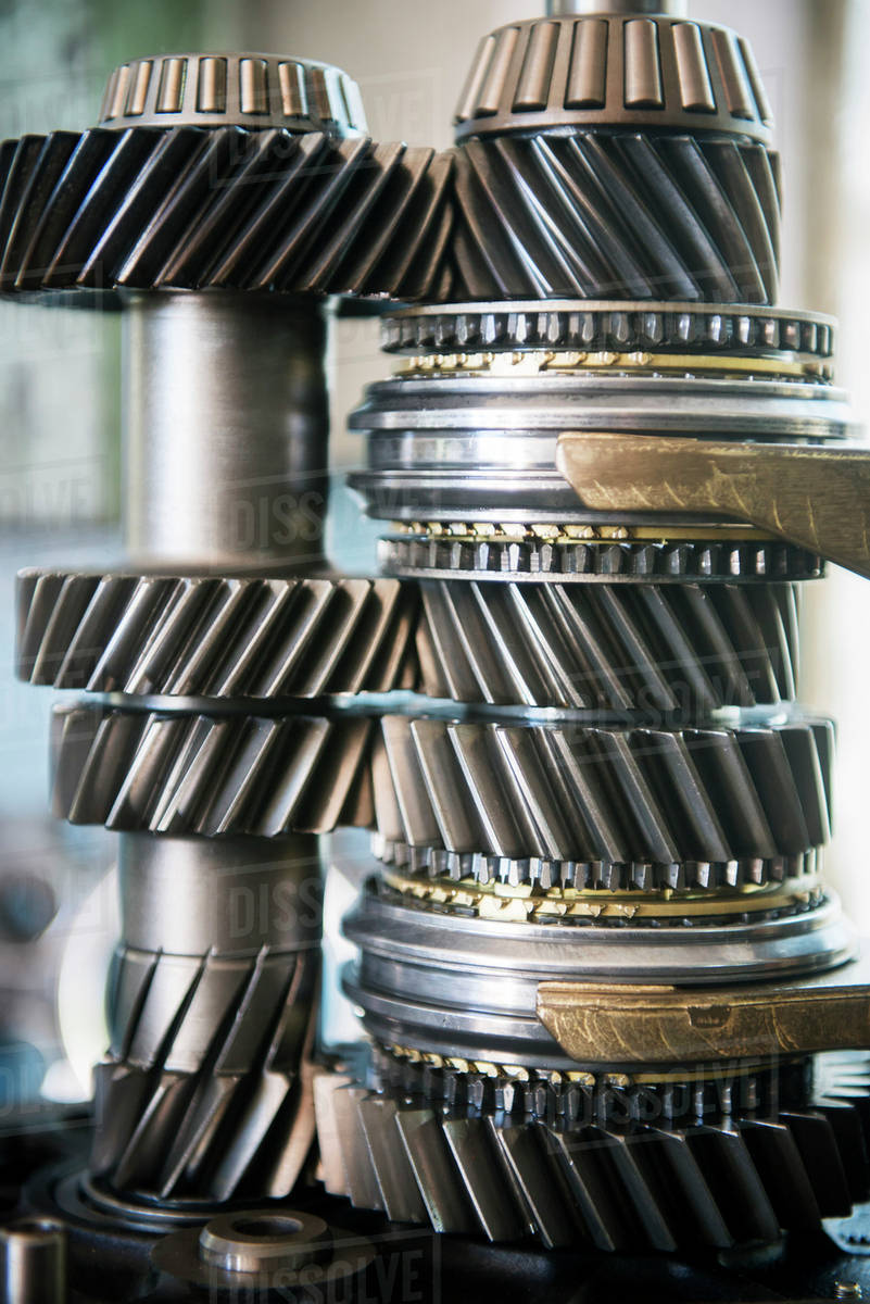 Gears waiting to be put into a broken down Land Rover; Zambia - Stock ...