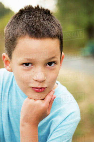Portrait of a young boy with his chin resting on his hand; Chilliwack ...